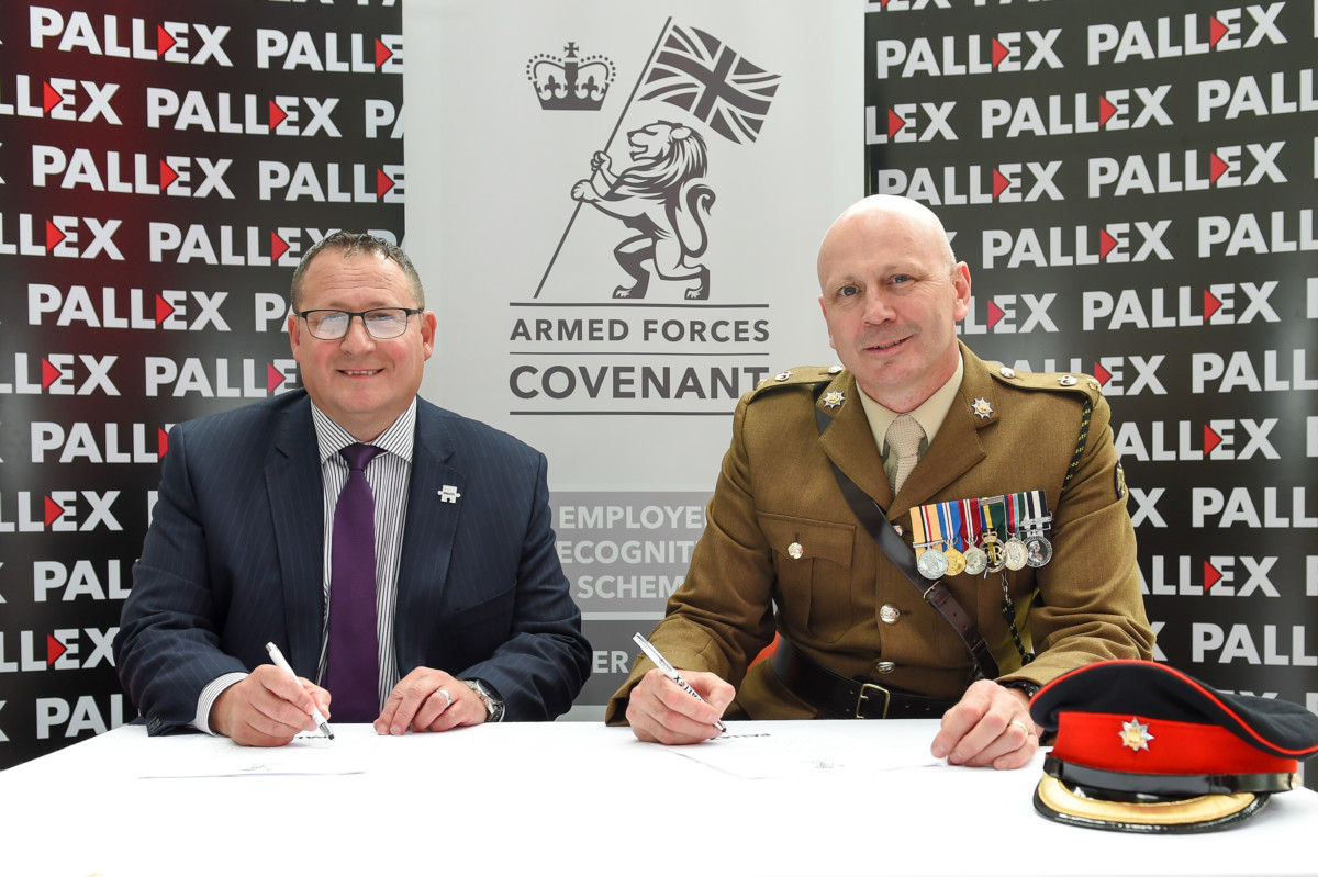 Pall-Ex Group managing director Kevin Buchanan signs the Armed Forces ...
